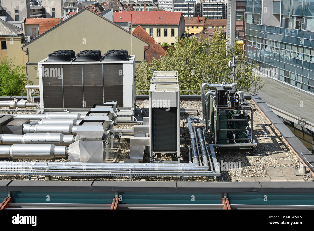 Air conditioners on the top of a building Stock Photo - Alamy