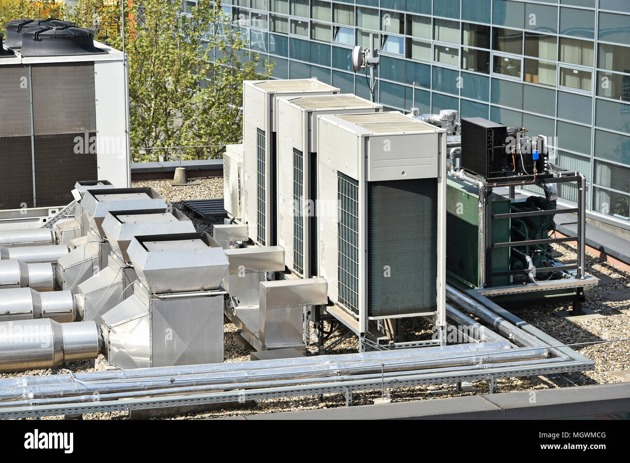 Air conditioners on the top of a building Stock Photo - Alamy