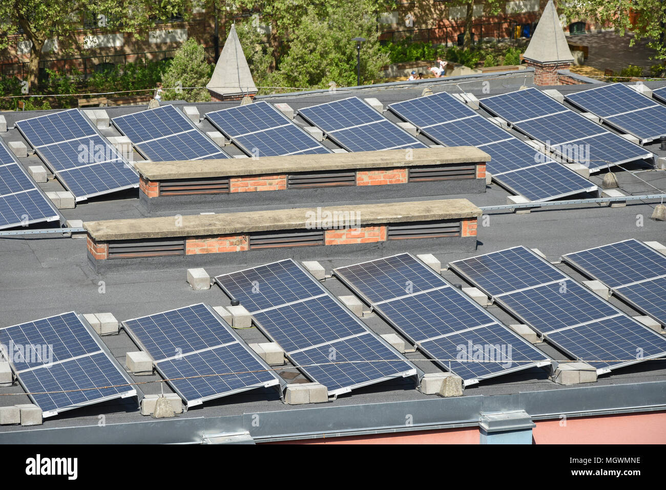 Solar panels on the top of a building Stock Photo - Alamy