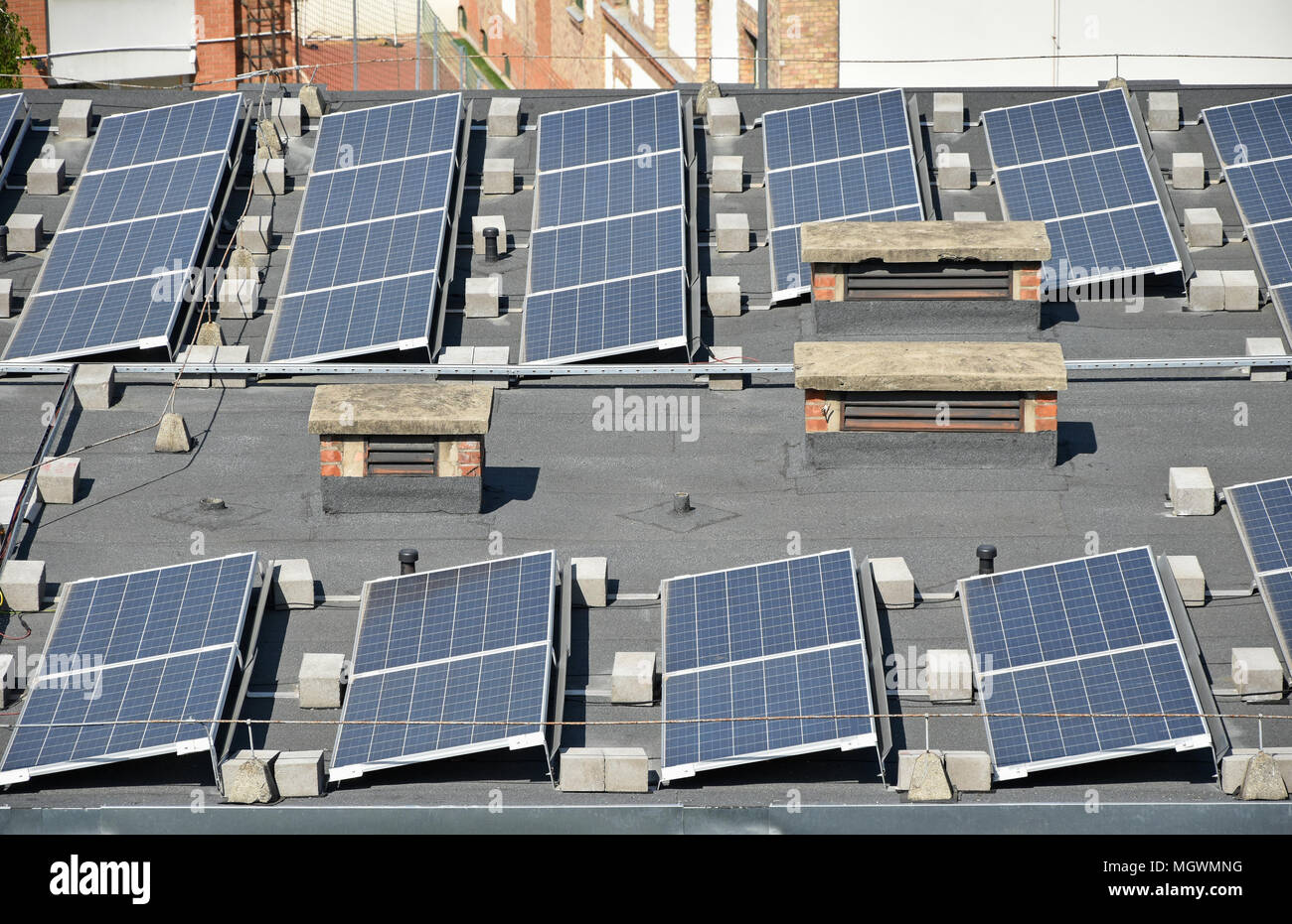 Solar panels on the top of a building Stock Photo - Alamy