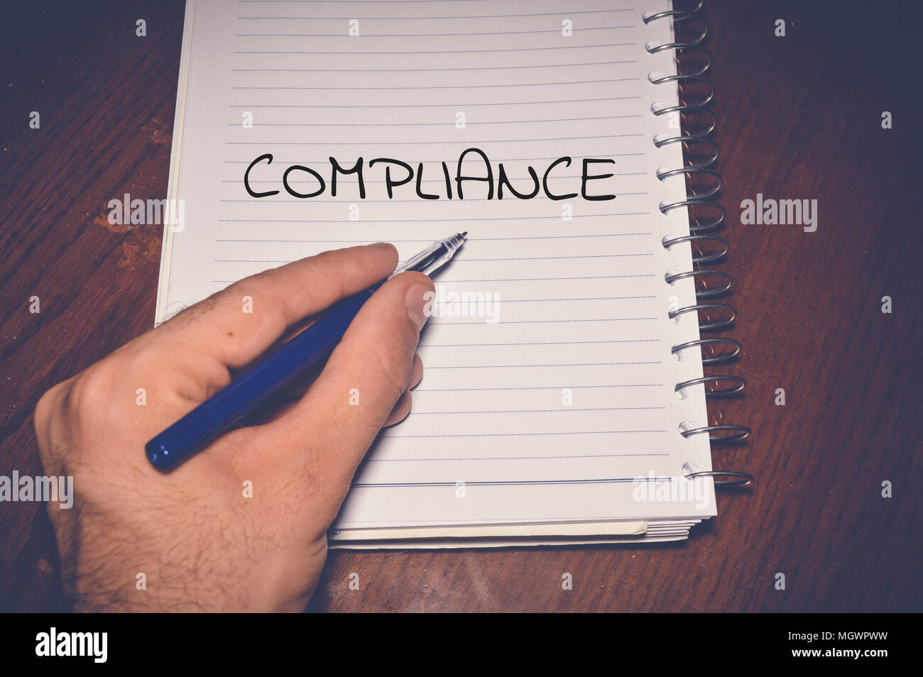 Compliance word written on white paper Stock Photo - Alamy