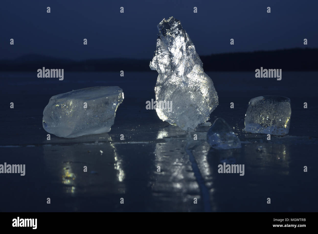 Frozen lake. Reflection of sun rays in flat ice on the lake. Air ...