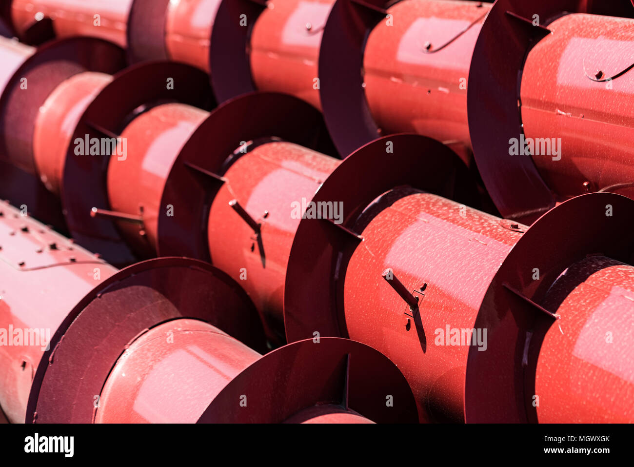 Brand new red auger conveyor for grain harvesters Stock Photo - Alamy
