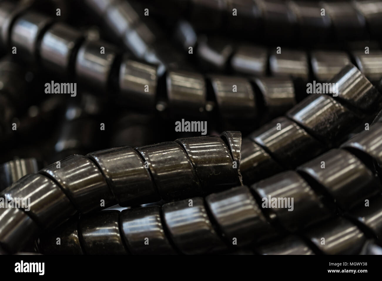 Black plastic cable screening braid Stock Photo - Alamy