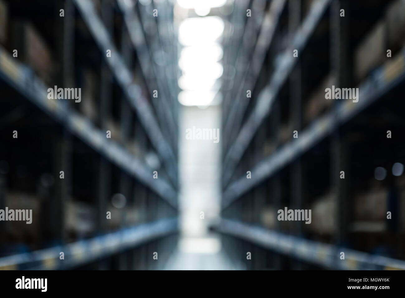 Blurred interior of modern spare parts warehouse Stock Photo - Alamy