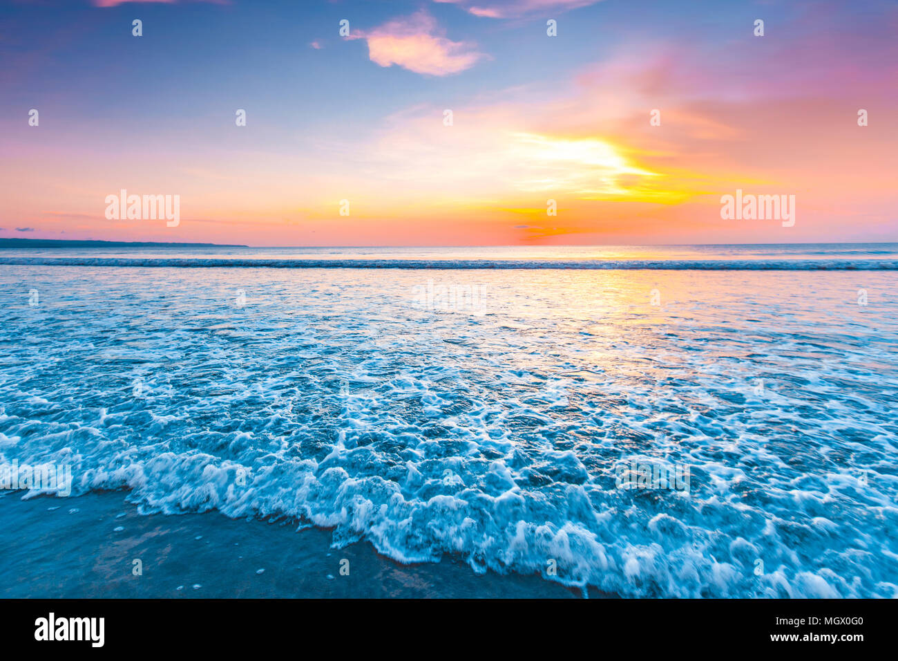 Radiant colorful sea beach sunset on Bali, Indonesia Stock Photo - Alamy
