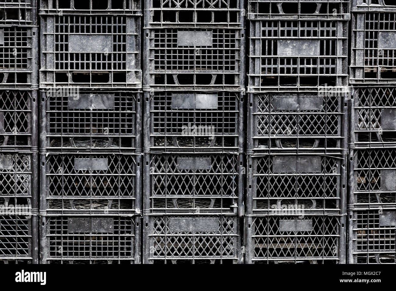 Black plastic boxes stacked on top of each other, background image ...