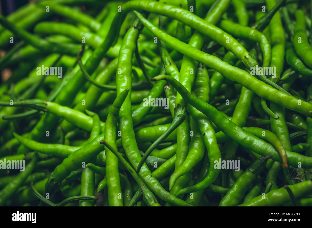 A bunch of green chillies in the market Stock Photo - Alamy