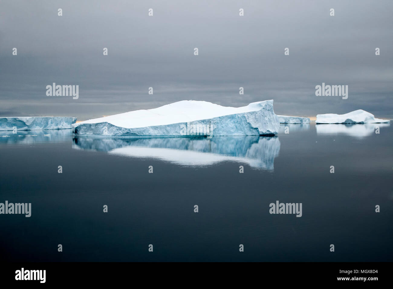 Southern Ocean Antarctica, iceberg field reflections with stormy sky ...