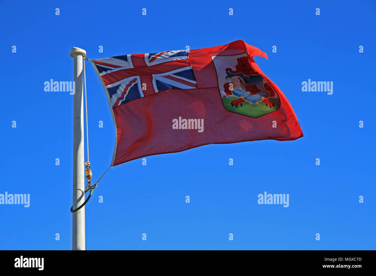 The Bermuda flag, flying against a deep blue sky Stock Photo - Alamy