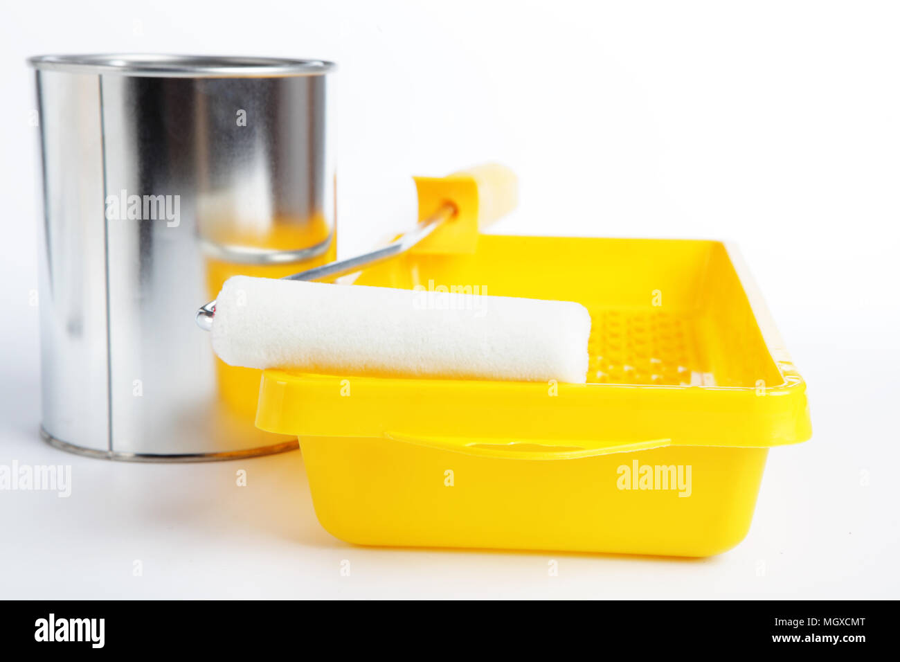 Paint roller, tray, and jar with paint isolated on white background ...