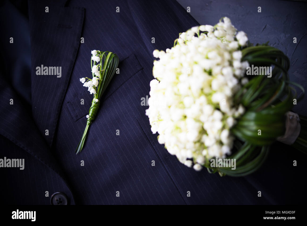 Beautiful may lilies in bride bunch on rustic background with copy ...