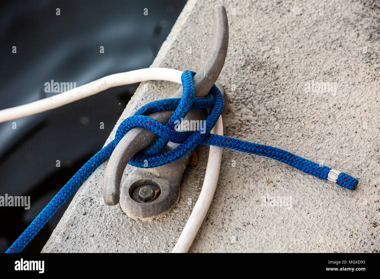White and Blue Lines Tied to a Cleat Stock Photo - Alamy