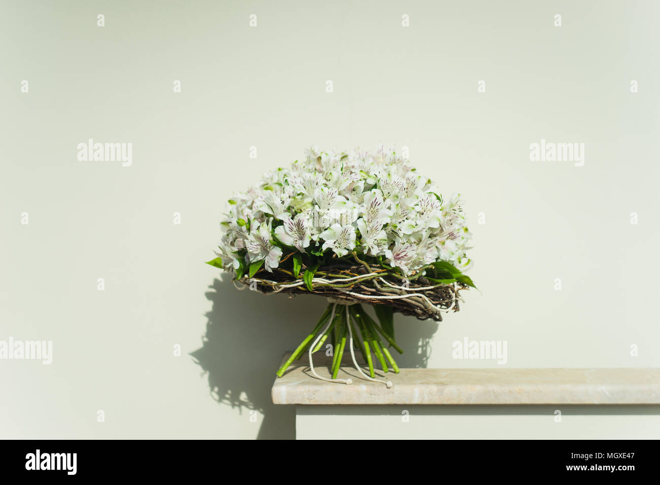White Lily of the Incas in a bunch on rustic background with copyspace ...