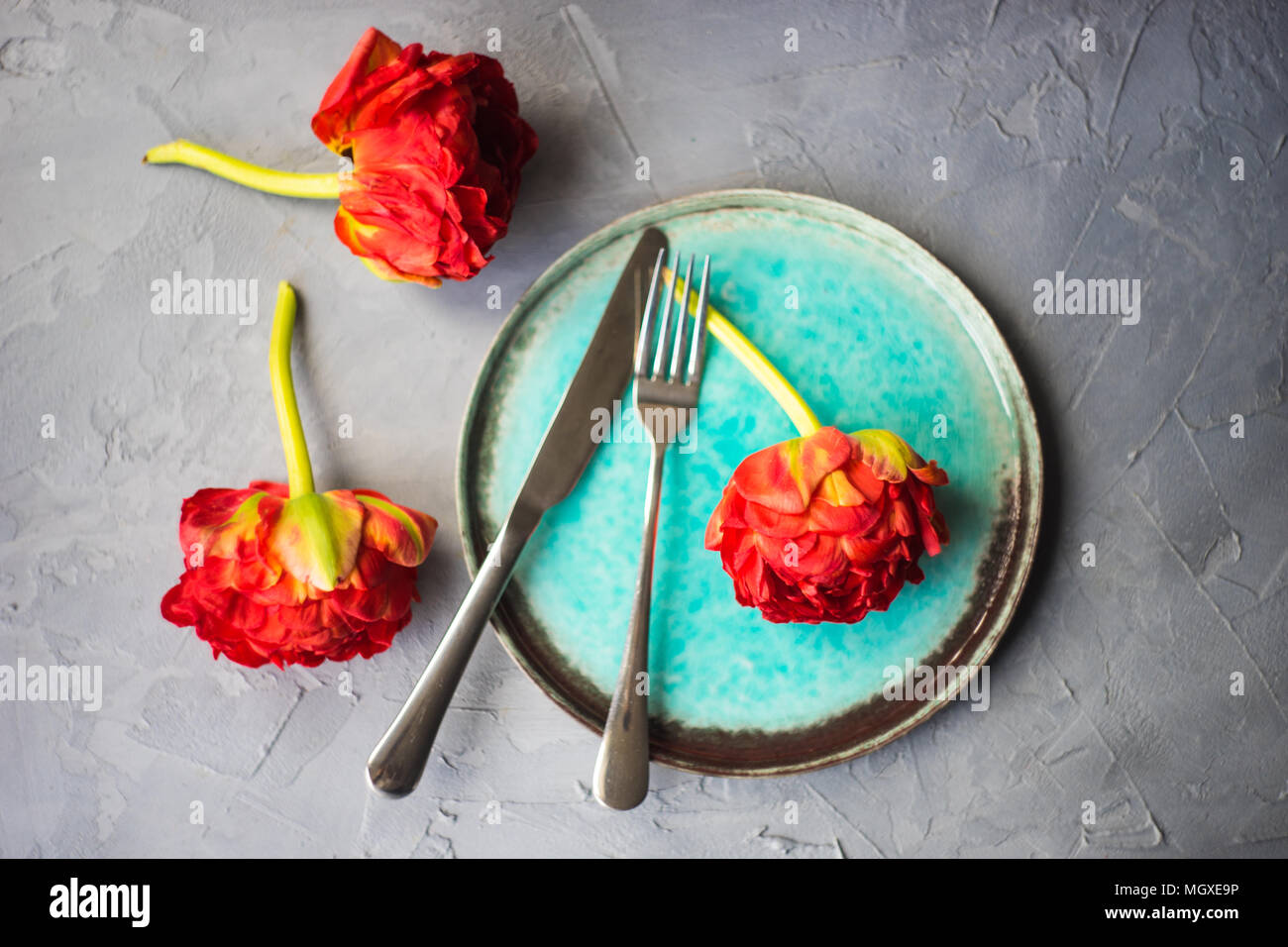 Summer table setting decorated with Red Princess tulips on rustic ...