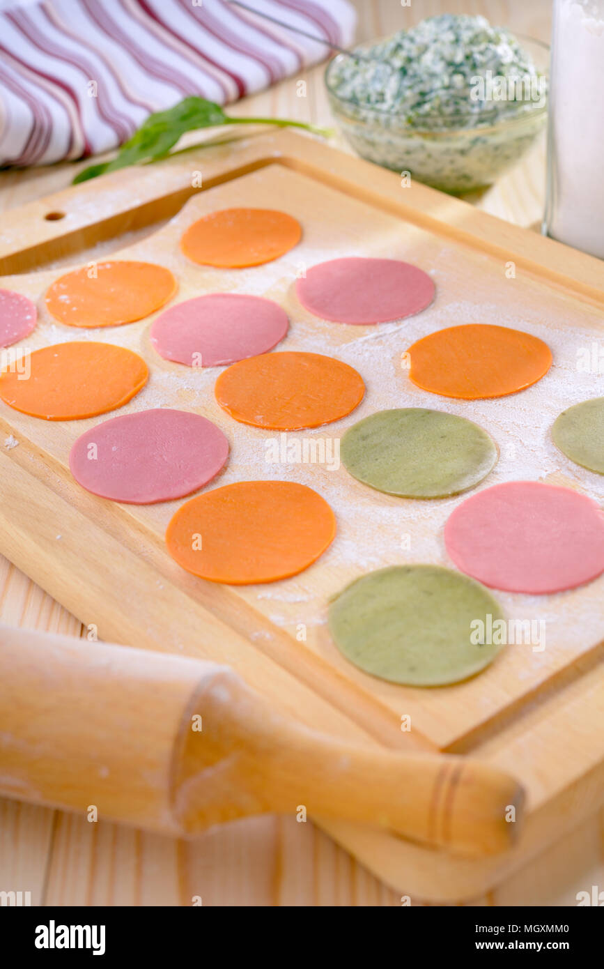 Cooking multi-colored ravioli with spinach and ricotta Stock Photo - Alamy