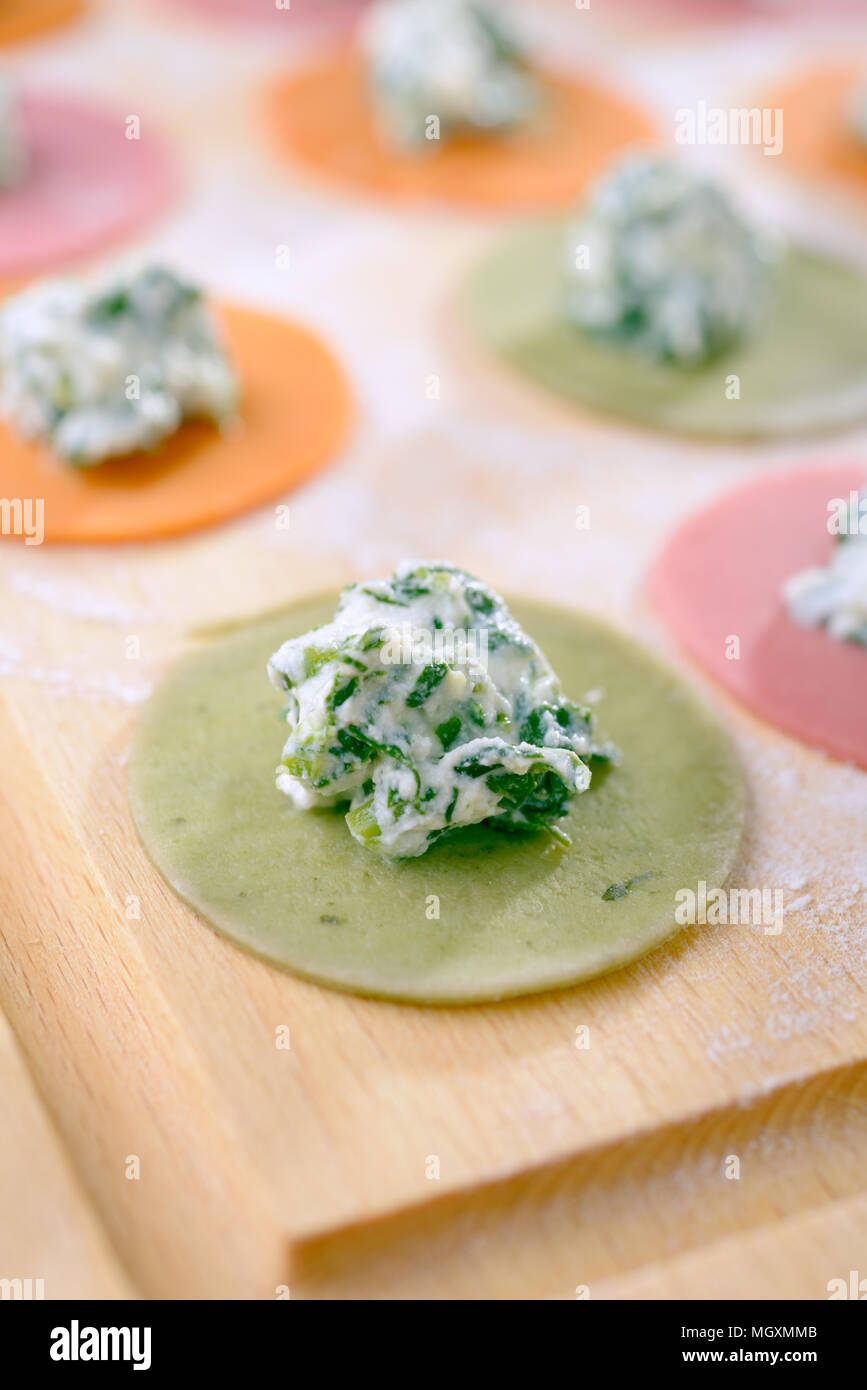 Cooking multi-colored ravioli with spinach and ricotta Stock Photo - Alamy