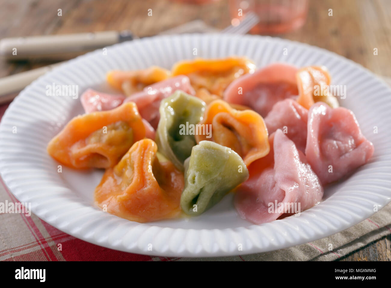 Multi-colored ravioli with spinach and ricotta Stock Photo - Alamy