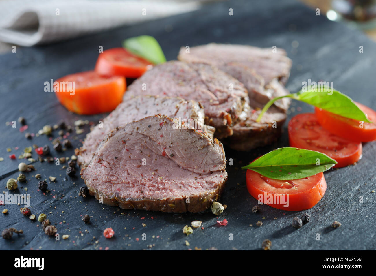 Sliced roast beef and vegetables on a slate board Stock Photo - Alamy