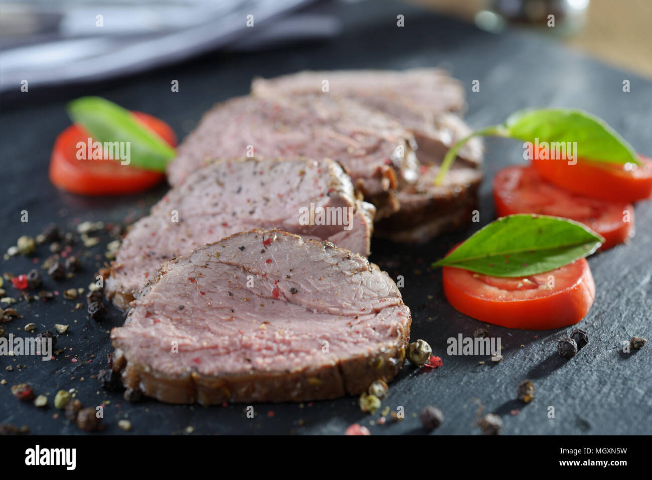 Sliced roast beef and vegetables on a slate board Stock Photo - Alamy