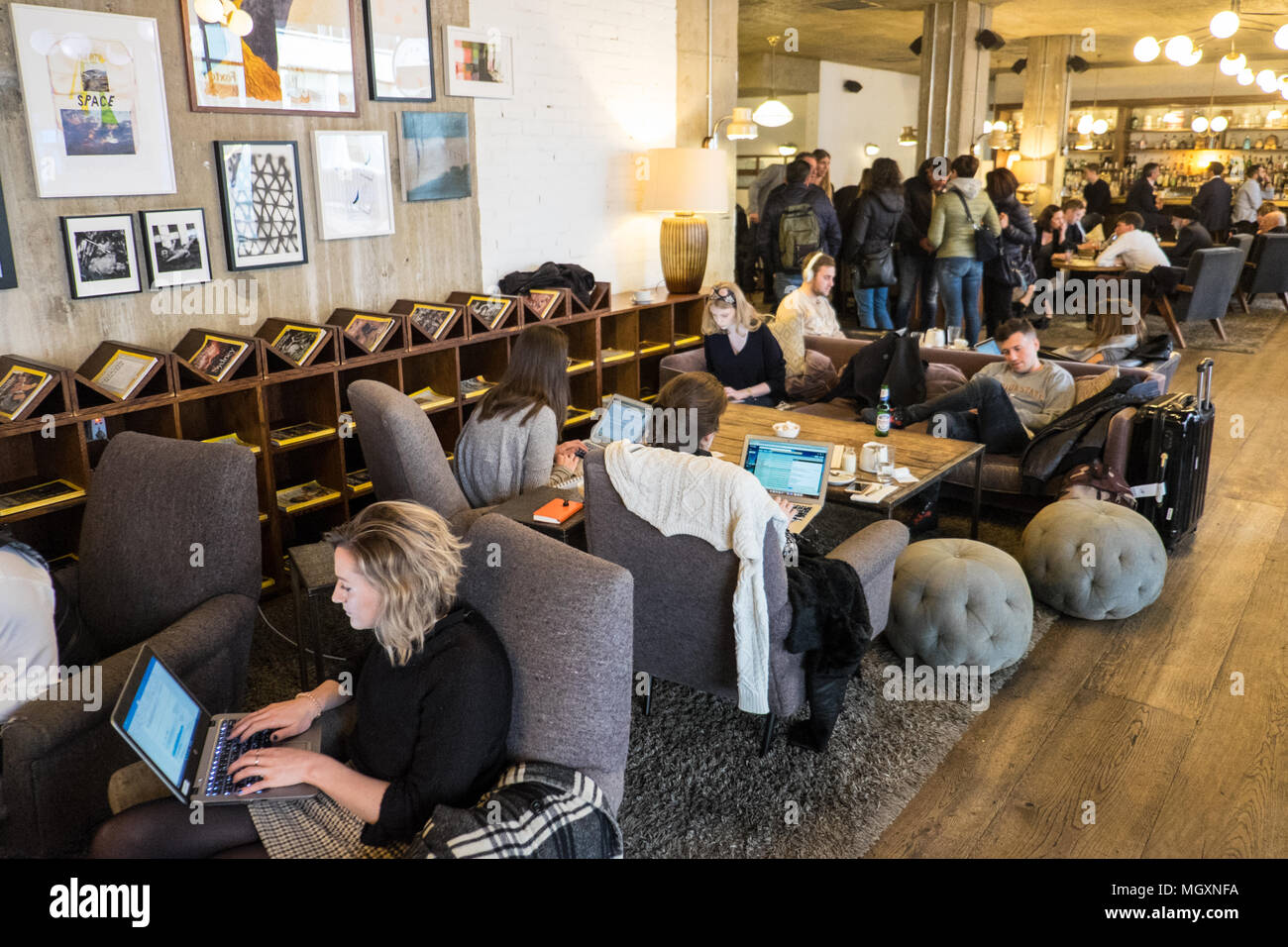 Using,mobile,devices,laptops,computers,ipads,at,trendy,Hoxton,Hotel,The ...