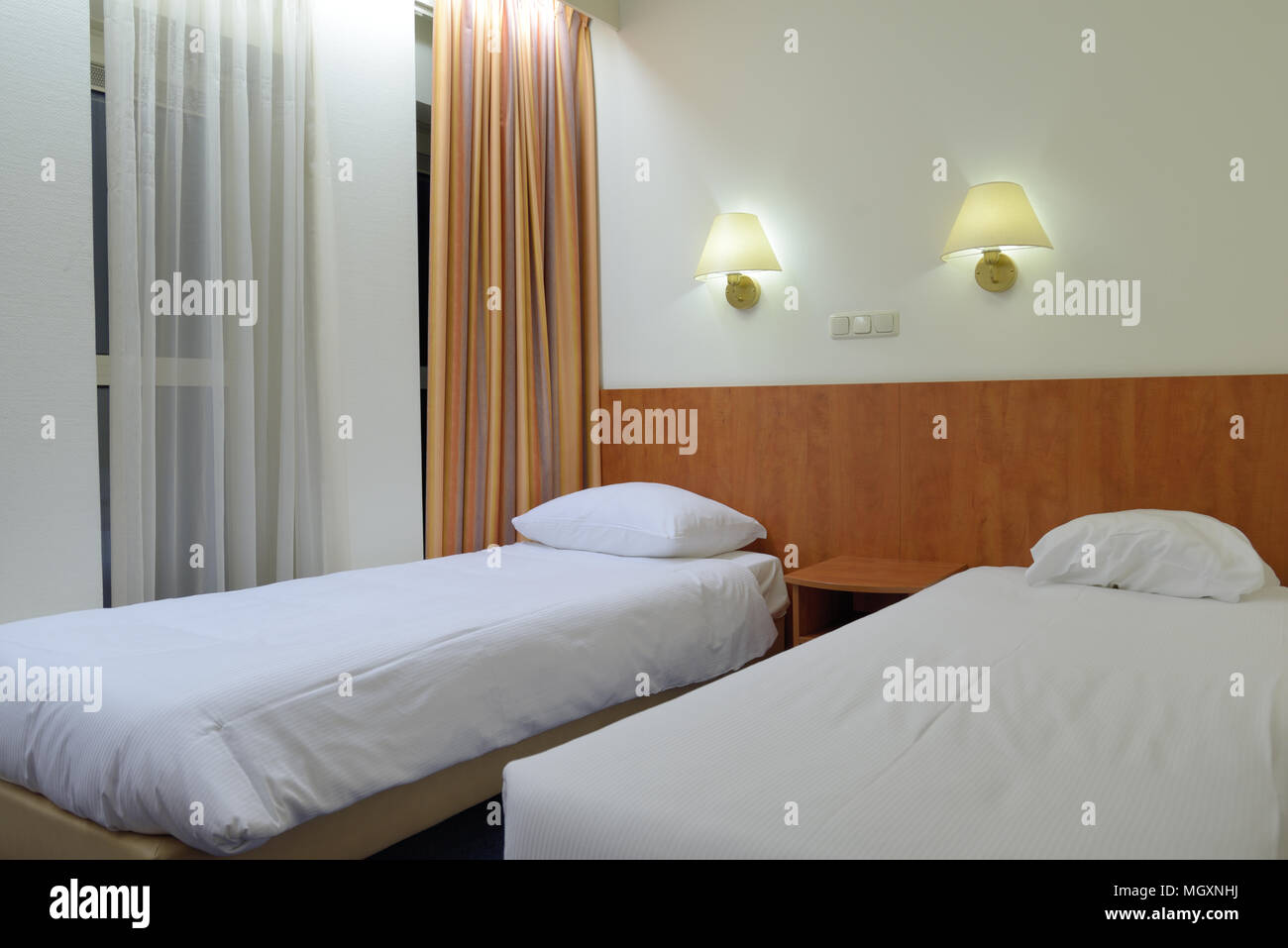 Interior of a twin room in a hotel Stock Photo - Alamy
