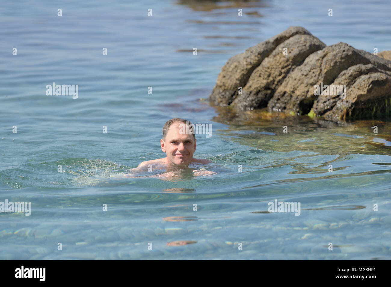 Man swimming in a sea Stock Photo - Alamy
