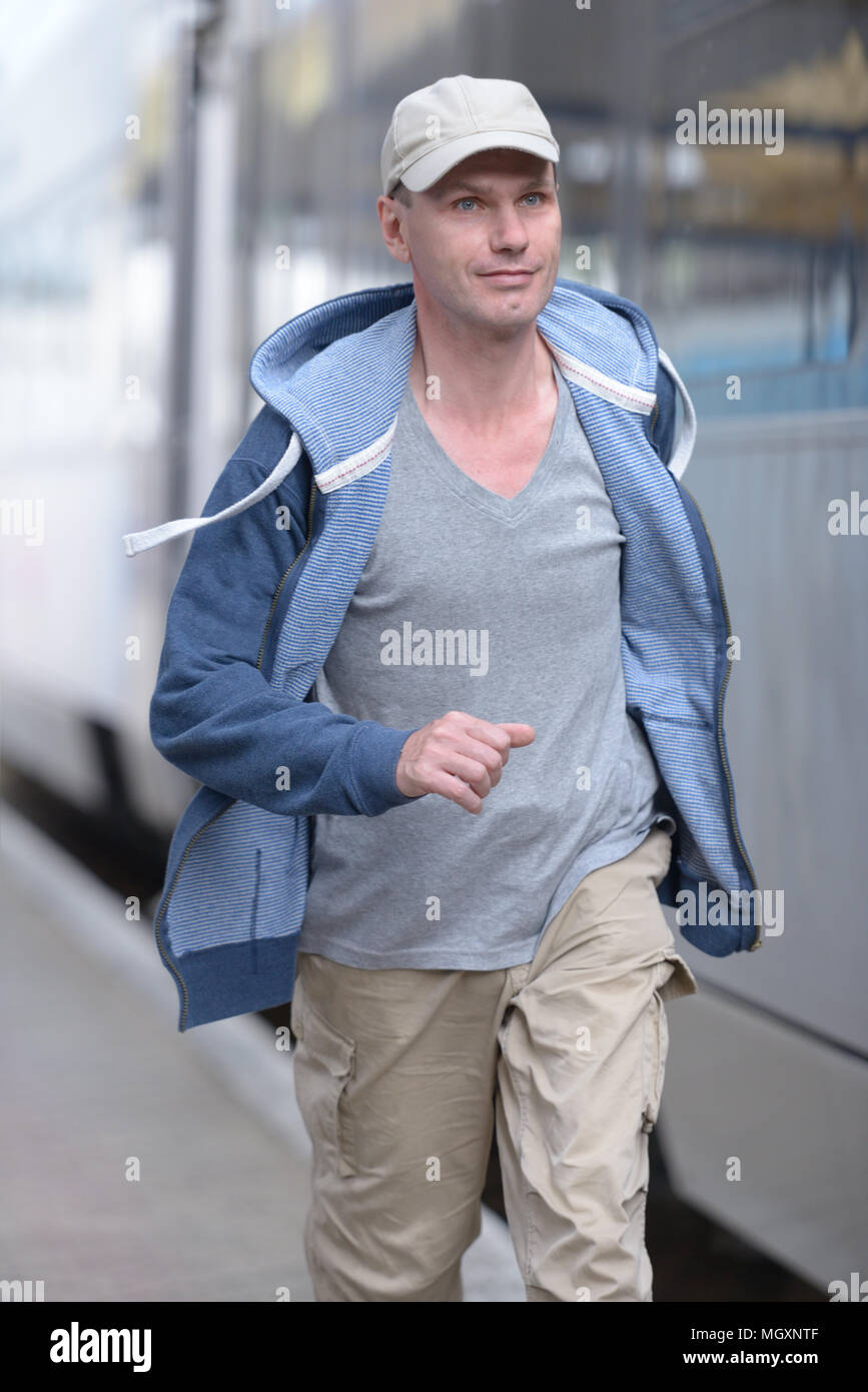 Man running train station hi-res stock photography and images - Alamy