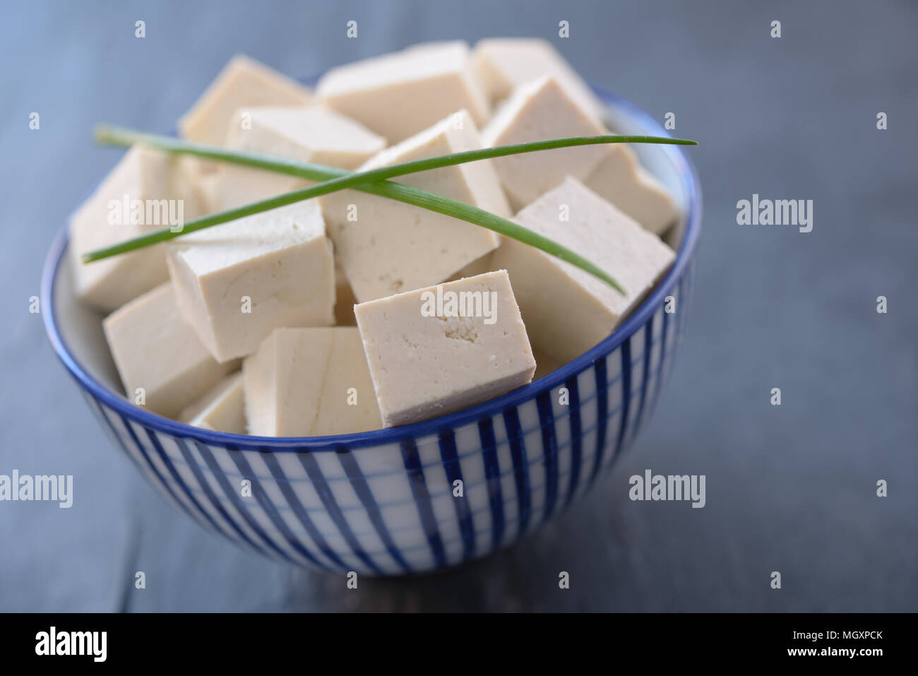 Cubes of tofu in a bowl Stock Photo - Alamy