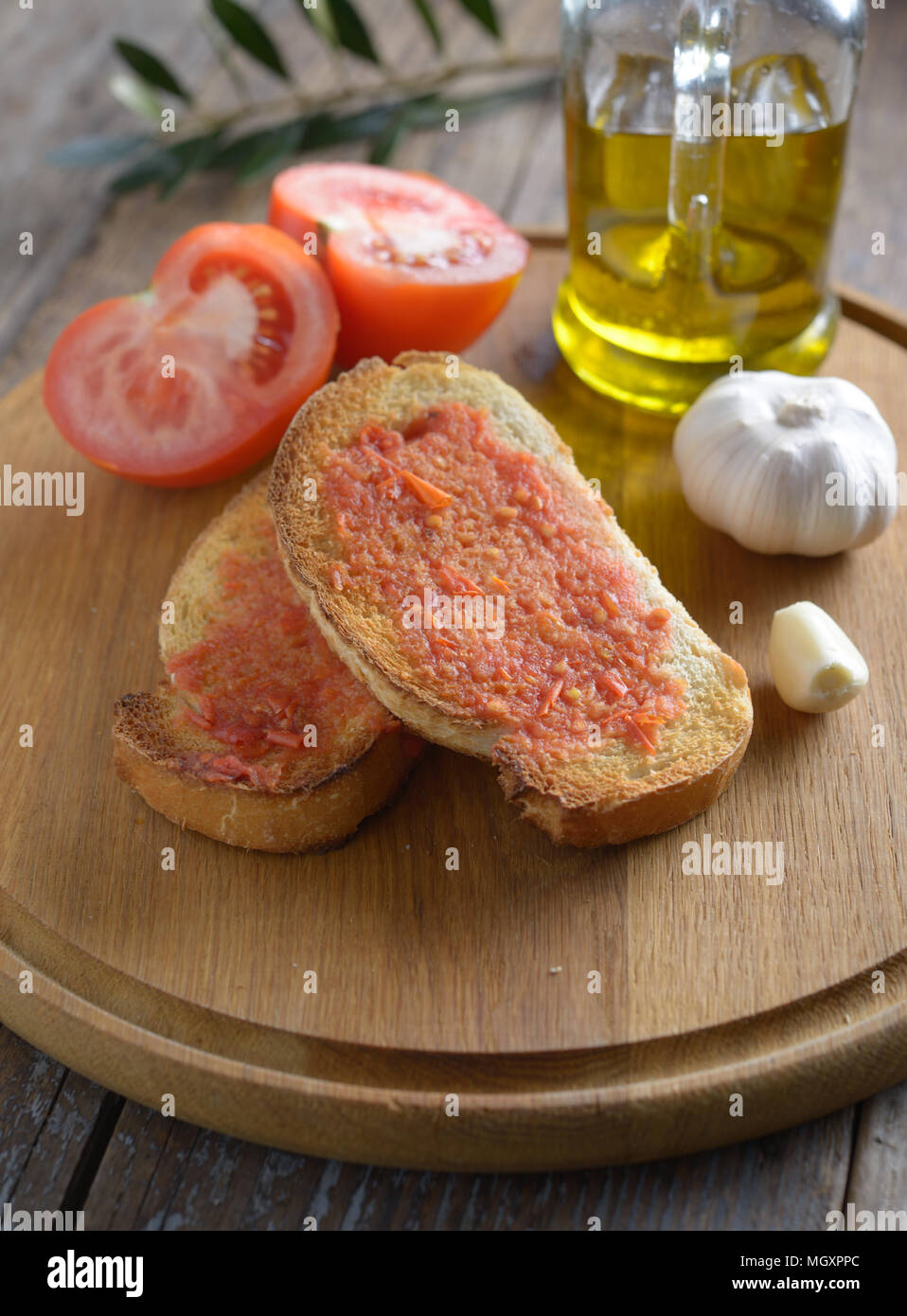 Pa amb tomaquet on a cutting board Stock Photo - Alamy