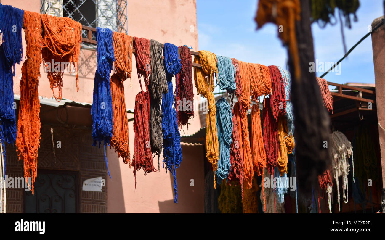 Colored wool, in the sun to dry Stock Photo - Alamy