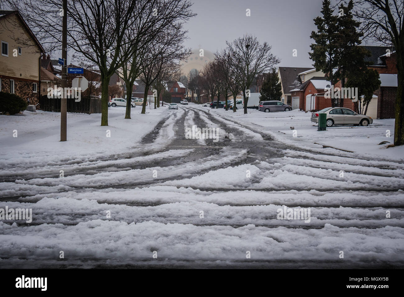 Snow and ice on the street creating a risky driving situation Stock ...