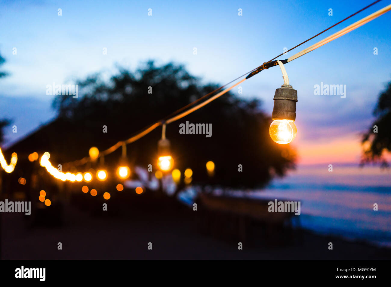 Beach promenade at night with party lights Stock Photo - Alamy