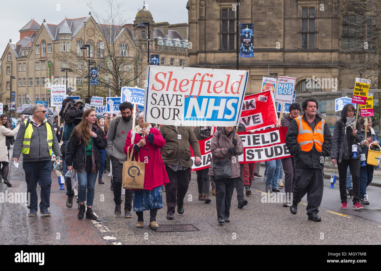 Demonstrators marching along Pinstone Street, with Town Hall in right ...