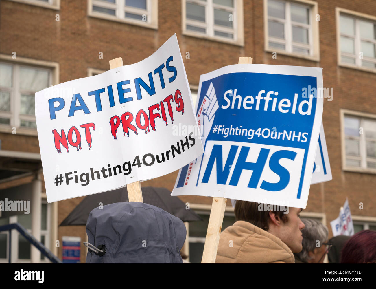 Demonstrators holding placards in at Sheffield Save our NHS protest ...
