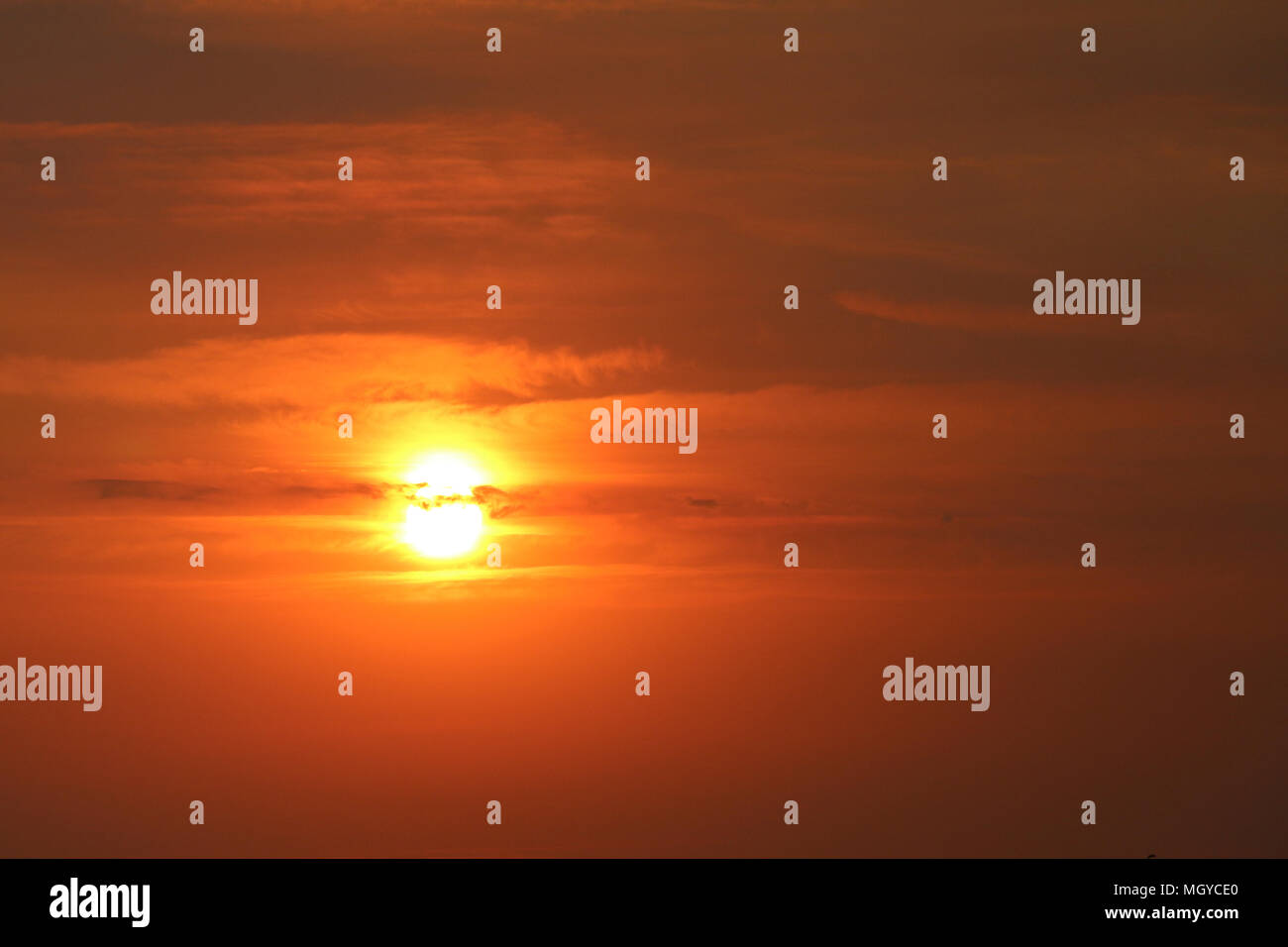 Bright orange dawn sunrise in a fiery sky Stock Photo - Alamy