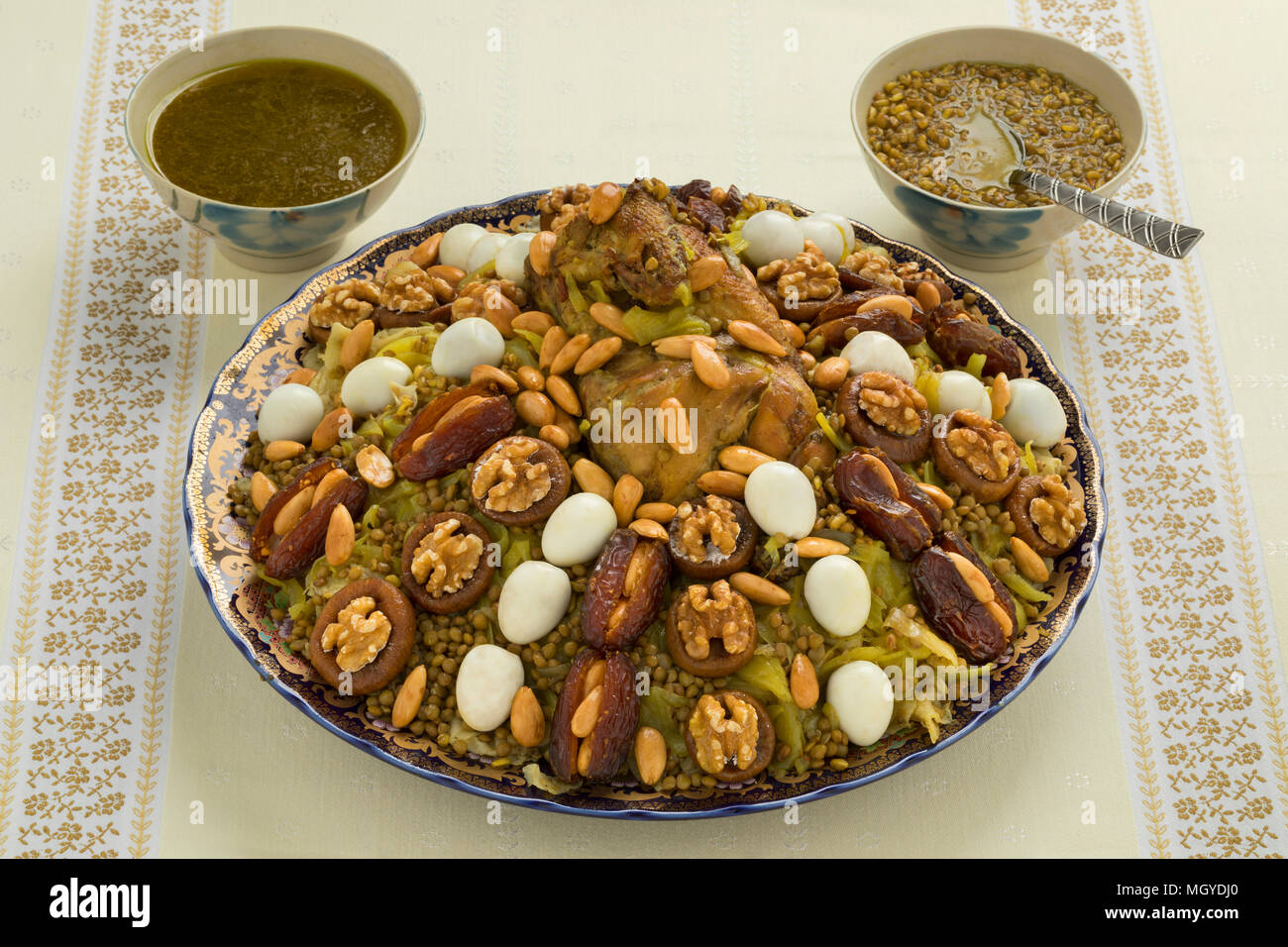 Festive traditional Moroccan Rfissa served with sauce and decorared ...