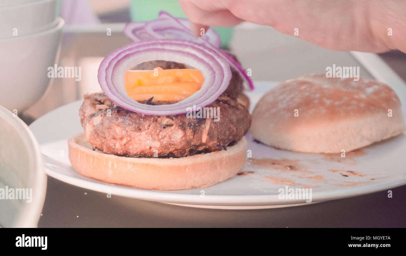 Gourmet classic beef burger on deli bun Stock Photo - Alamy