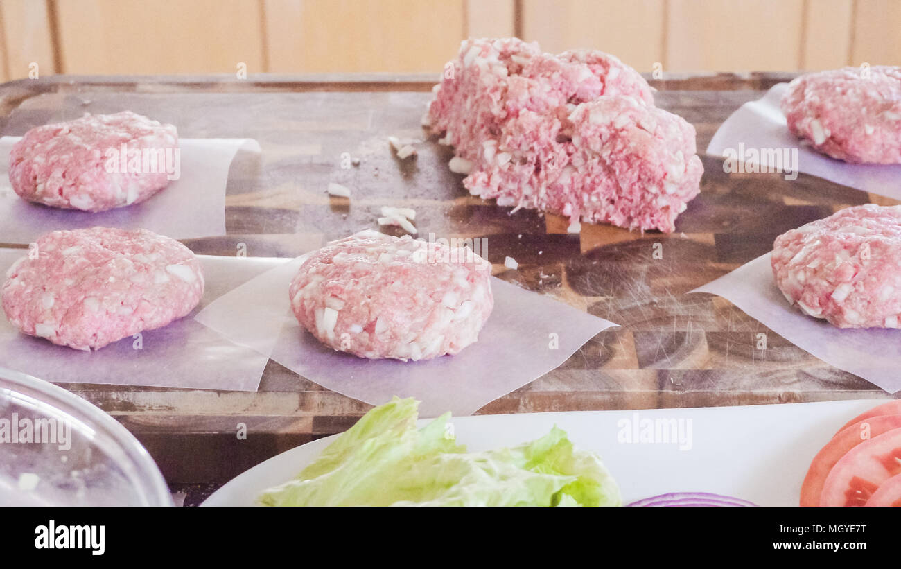 Preparing gourmet burger patties with ground beef Stock Photo - Alamy