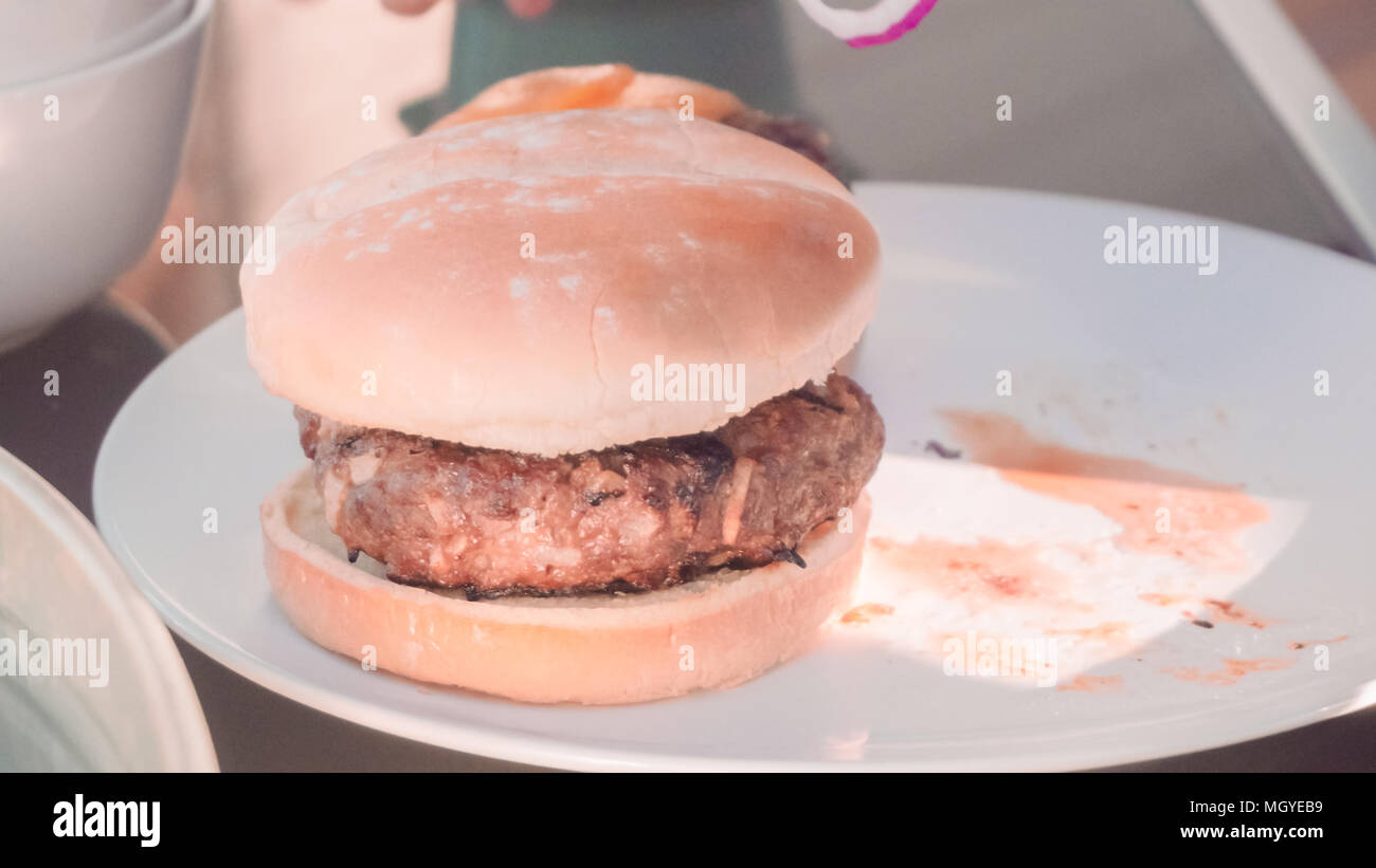 Gourmet classic beef burger on deli bun Stock Photo - Alamy