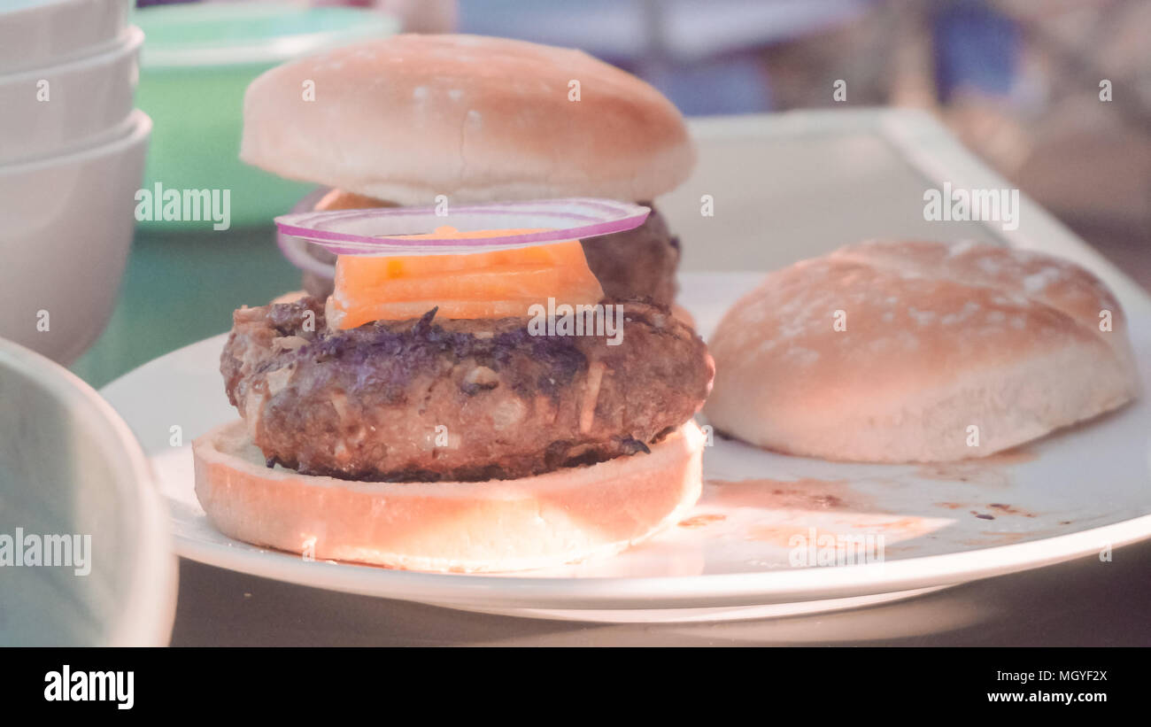 Gourmet classic beef burger on deli bun Stock Photo - Alamy