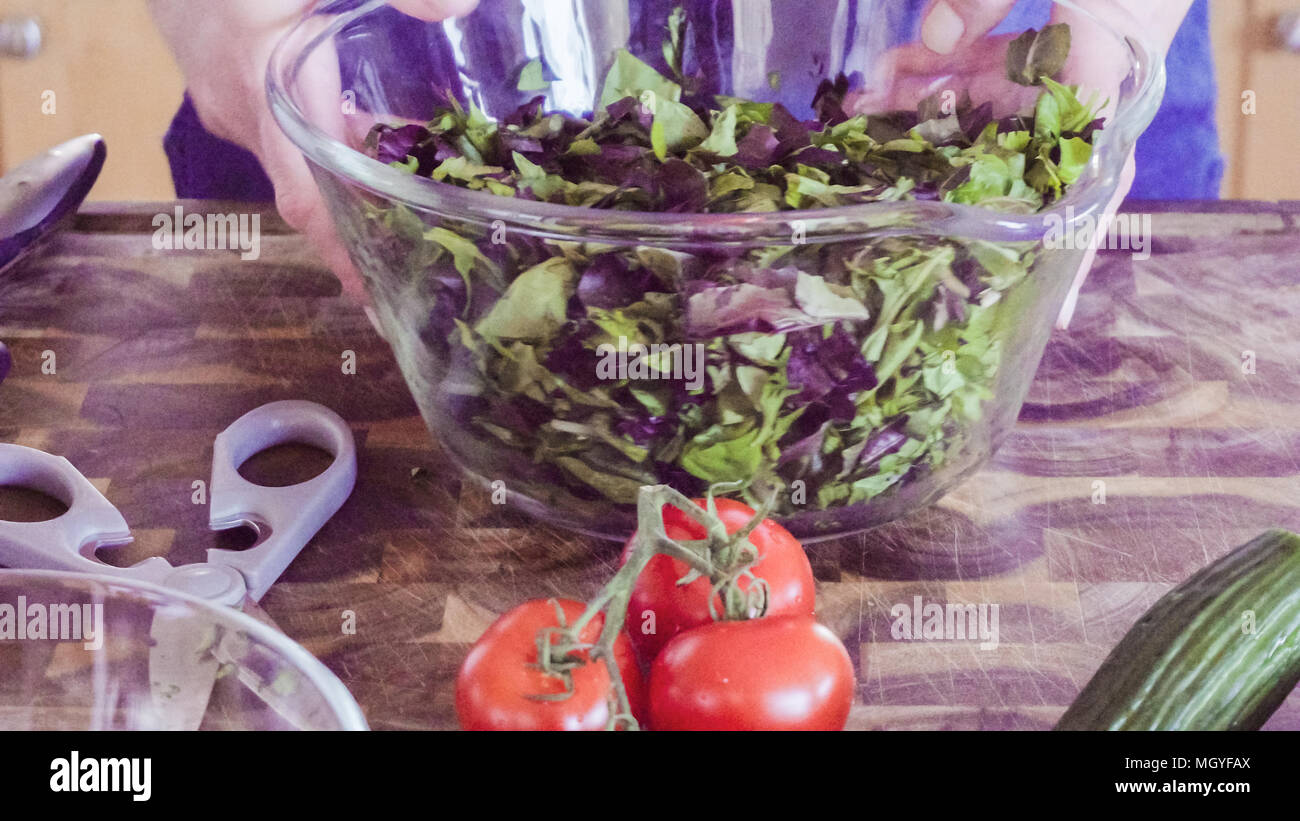 Mixing fresh salad with Spring mix greens Stock Photo - Alamy