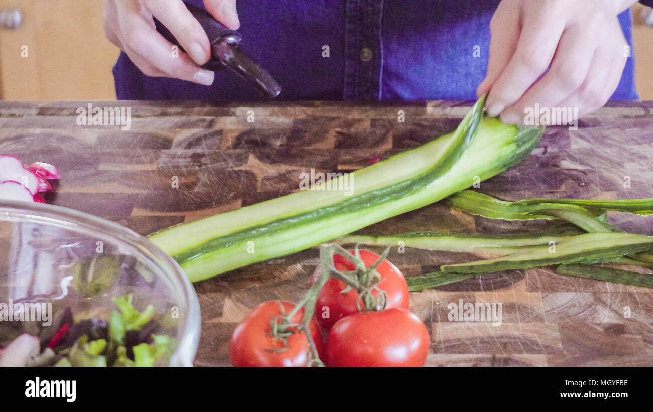 Slicing fresh vegetables for Spring salad Stock Photo - Alamy