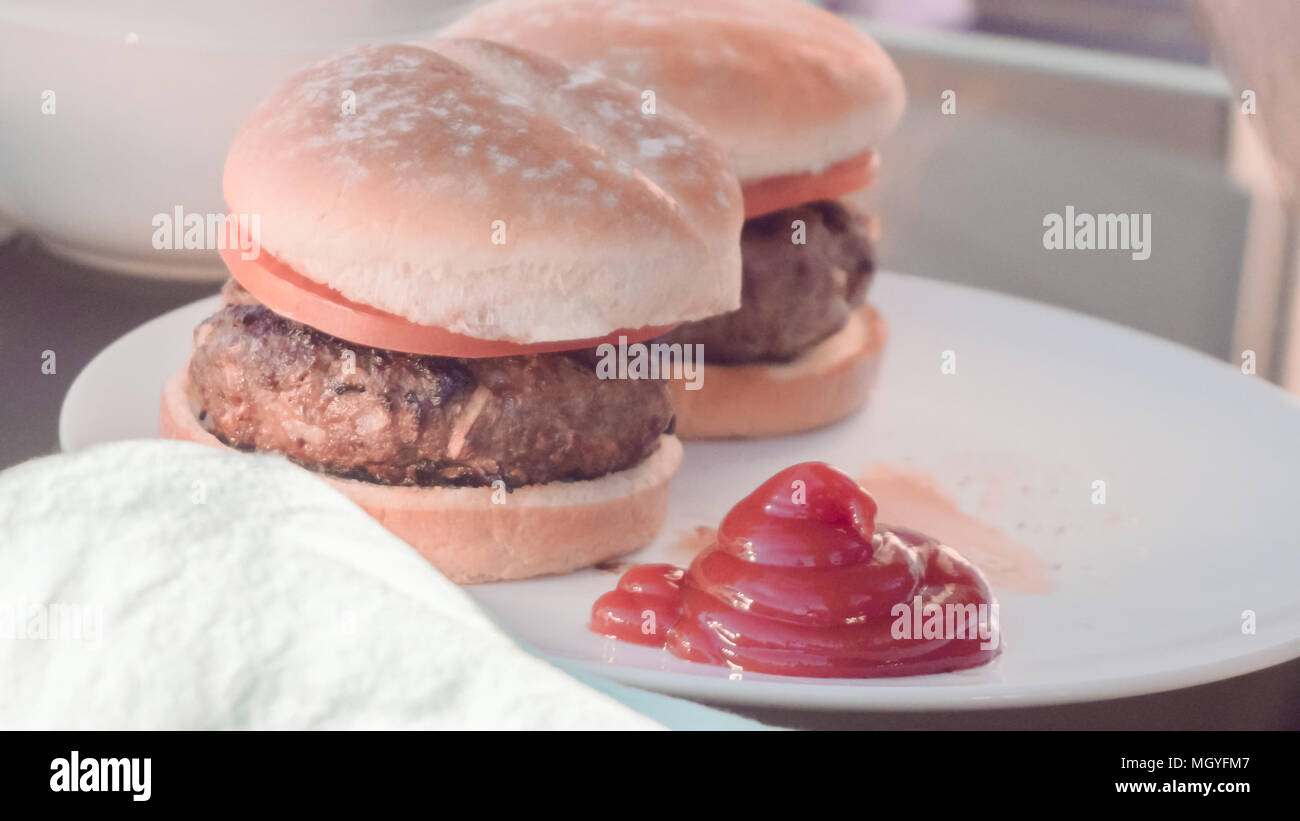 Gourmet classic beef burger on deli bun Stock Photo - Alamy