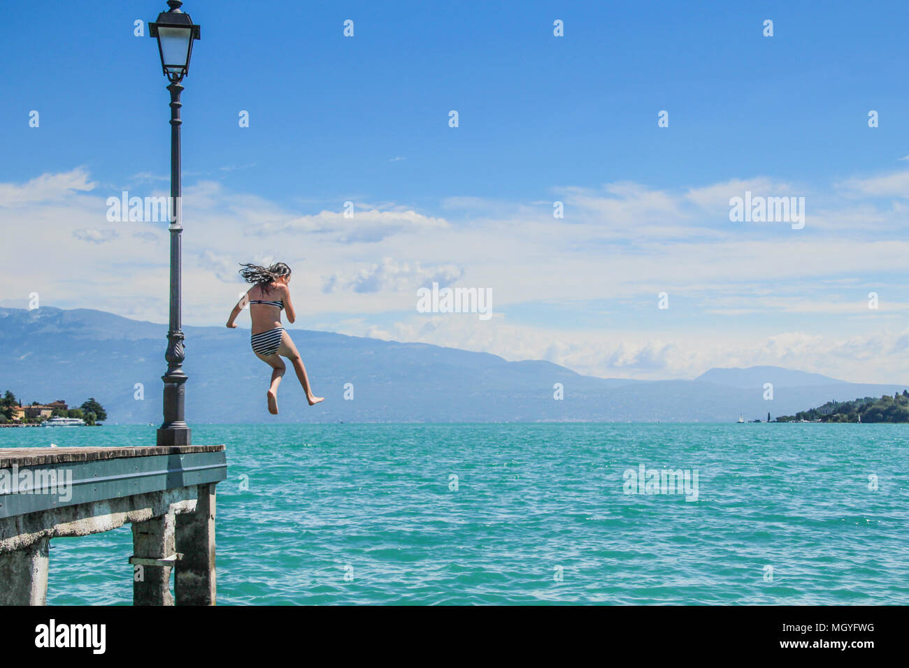 Child girl lake jump hi-res stock photography and images - Alamy