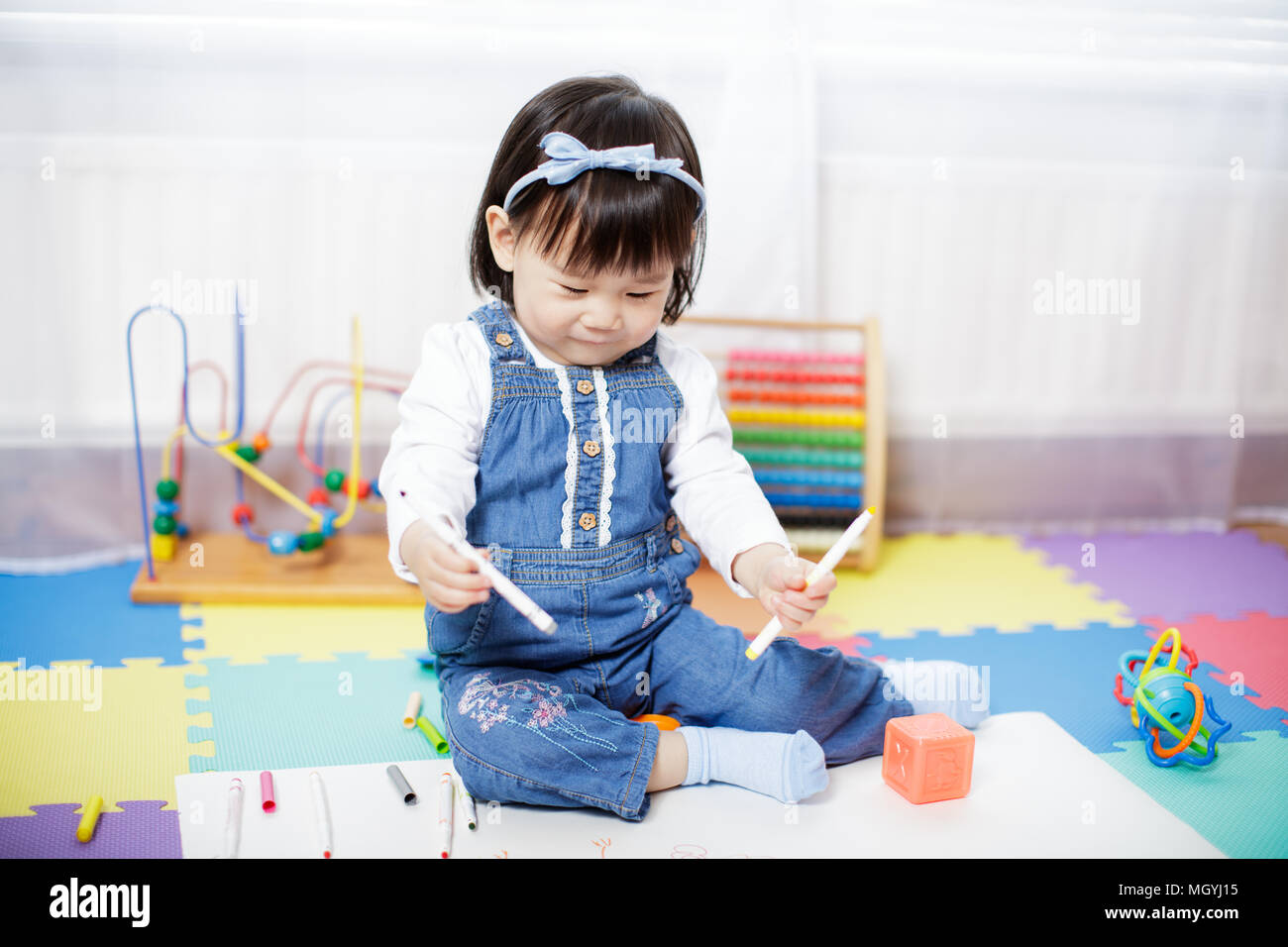 baby girl painting at home Stock Photo - Alamy