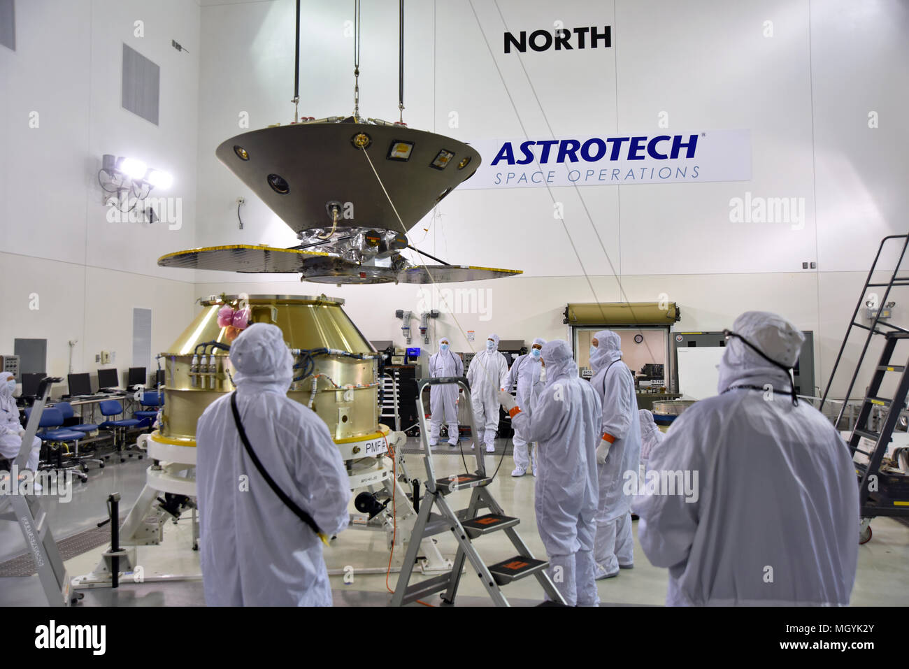 In the Astrotech facility technicians and engineers place the ...