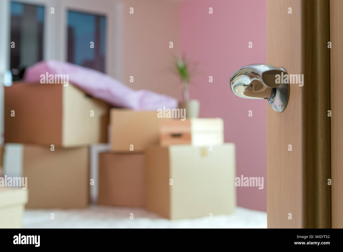 Photo of cardboard boxes, open door in new apartment Stock Photo - Alamy