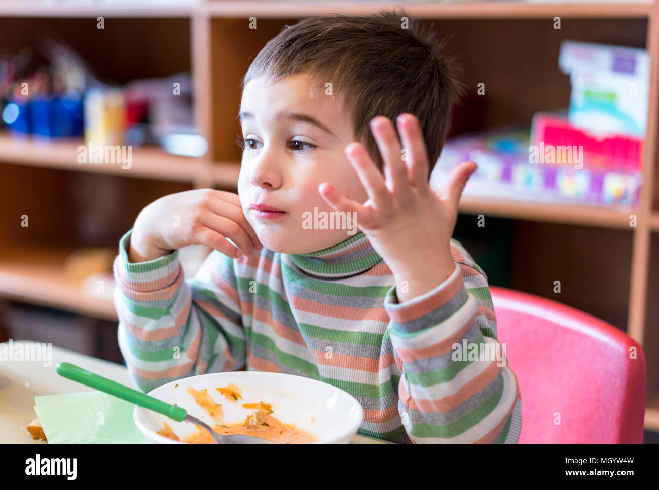 A boy at the age of 5 raising hand to the kindergarten Stock Photo - Alamy