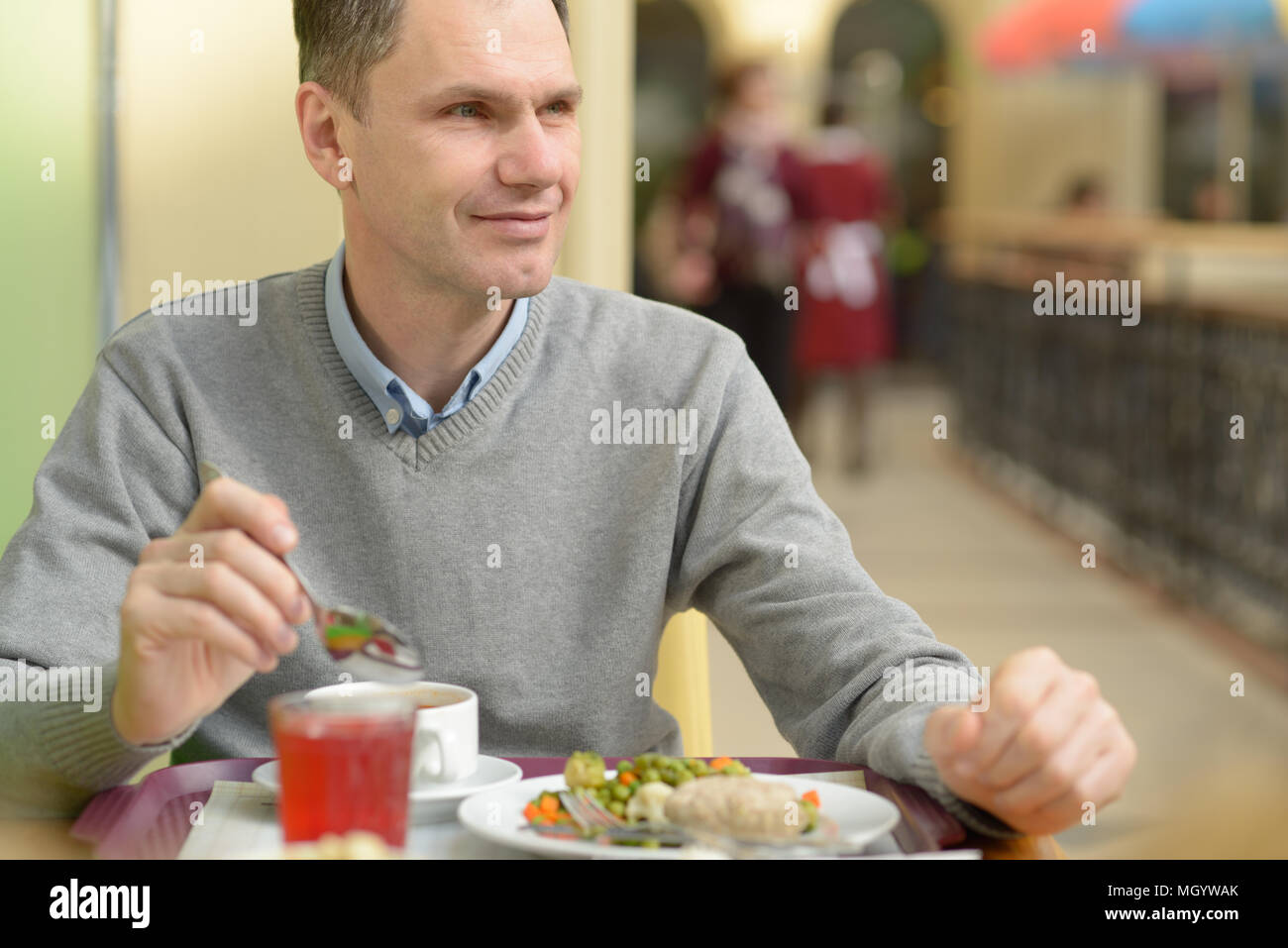 Man eating his dinner in a restaurant Stock Photo - Alamy